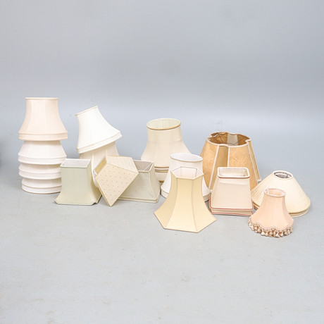 A COLLECTION OF LAMP SHADES OF VARYING SHAPES, SIZES AND MATERIALS ...
