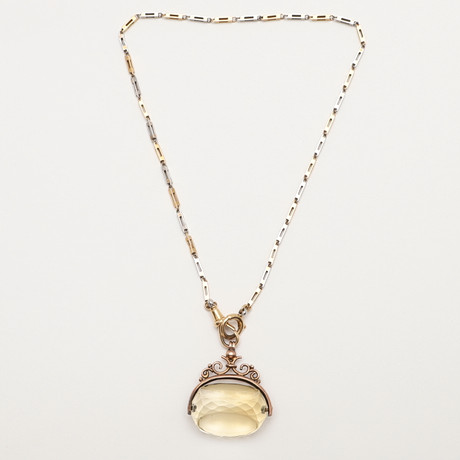 AN 18CT GOLD AND PLATINUM WATCH CHAIN AND A CITRINE SPINNING FOB ...