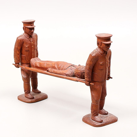 WOODEN SCULPTURE, Nurse carries stretcher with patient, signed. Art ...