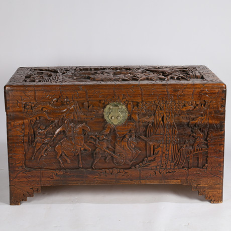 CHINESE CAMPHOR WOOD CHEST, CARVED IN RELIEF WITH FIGURES ON HORSEBACK ...