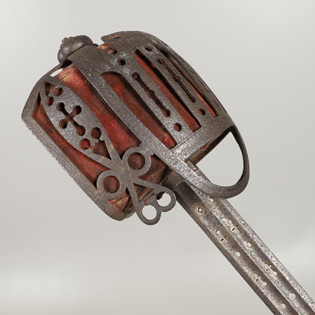 A 19TH CENTURY SCOTTISH BASKET HILTED SWORD WITH DECORATIVE PIERCED ...