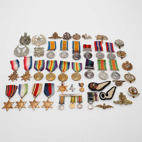 A COLLECTION OF ENGLISH MEDALS AND MILITARY INSIGNIA, LATE 19TH CENTURY ...