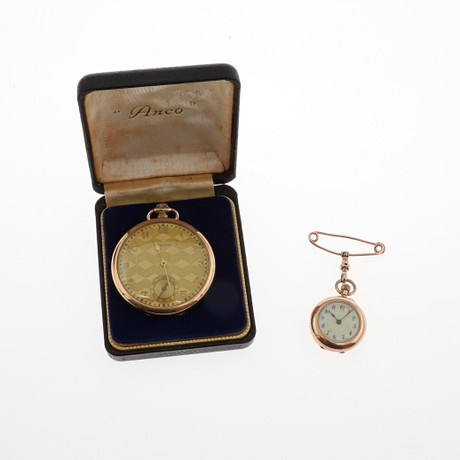 A 9CT GOLD LADIES FOB/NURSES WATCH AND A GOLD PLATED POCKET WATCH ...