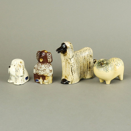 LISA LARSON. Figurines, 4 dogs, from the "Kennel" series, stoneware ...