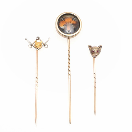 A VICTORIAN PAINTED FOX MASK STICKPIN AND 2 FURTHER GOLD FOX STICK PINS ...