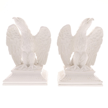 A PAIR OF WHITE GLAZED PORCELAIN BOOKENDS IN THE FORM EAGLES, 20TH ...