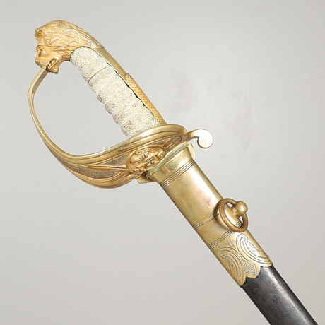 A VICTORIAN ROYAL NAVAL RESERVE OFFICER'S SWORD AND SCABBARD. Weapons ...