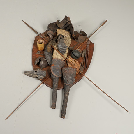 AN UNUSUAL OAK SHIELD MOUNTED WITH MILITARY TROPHIES, CURIOSITIES AND ...