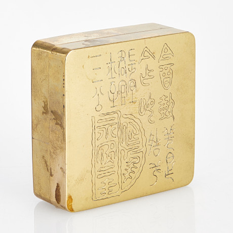 A Chinese ink box, late 19th century, brass, engraved decoration of ...