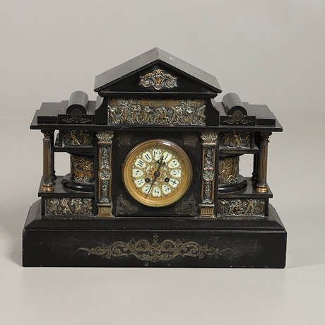 A VICTORIAN POLISHED SLATE AND METAL MOUNTED MANTEL CLOCK. Clocks ...