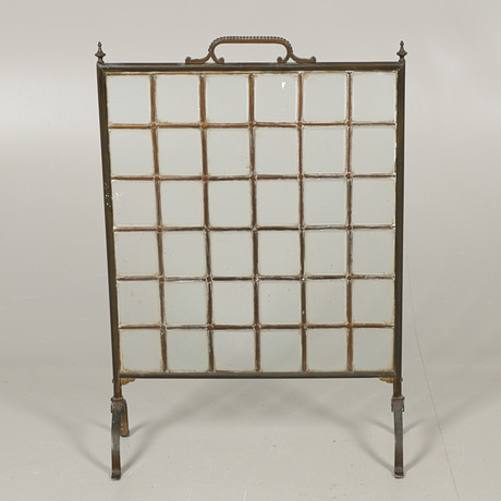 AN EDWARDIAN BRASS AND BEVELLED GLASS LEADED LIGHT FIRE SCREEN. Silver ...