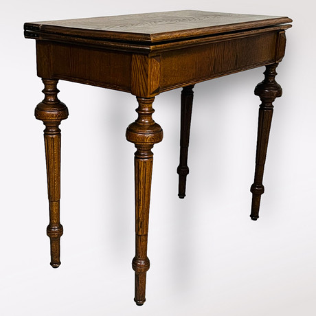 A NEO-RENAISSANCE OAK GAMING TABLE. Furniture - Tables - Auctionet