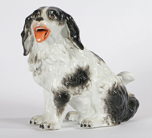 A MEISSEN STYLE PORCELAIN MODEL OF A BLACK AND WHITE KING CHARLES ...
