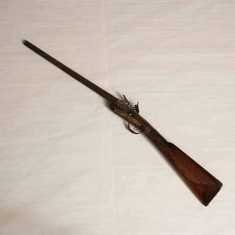 A FLINT LOCK RIFLE, second half of the 18th century. Weapons ...