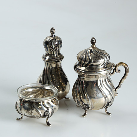 A mustard pot, a 3-piece silver salt bowl, rococo style, Denmark, first ...