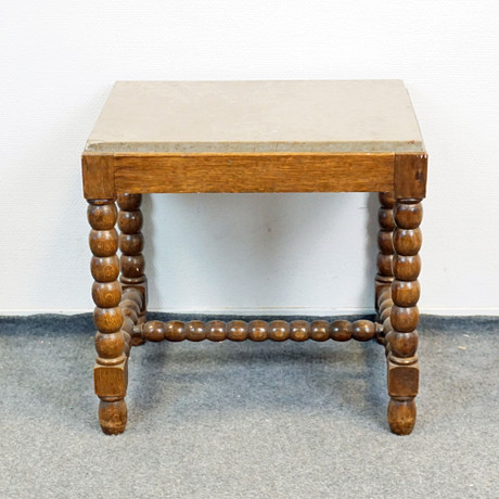 A side table, baroque style with limestone top, 20th century. Furniture ...