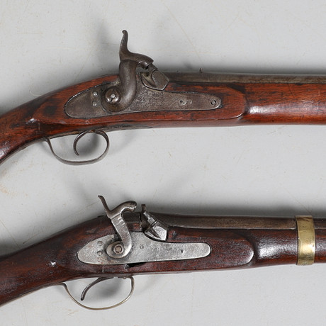 A 19TH CENTURY ENFIELD TYPE PERCUSSION FIRING RIFLE AND ANOTHER SIMILAR ...
