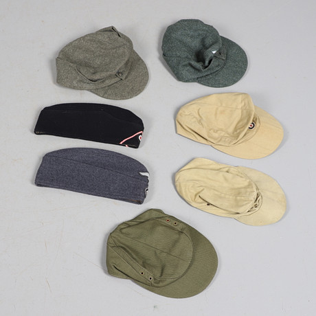 A COLLECTION OF SECOND WORLD WAR GERMAN TYPE SKI CAPS AND SIDE CAPS ...