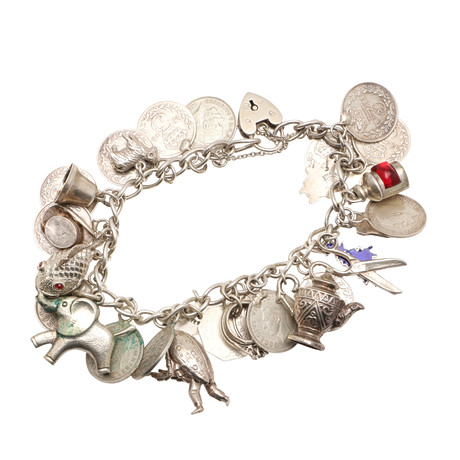 A SILVER BRACELET WITH ATTACHED THREEPENNY BITS AND CHARMS. Jewellery ...