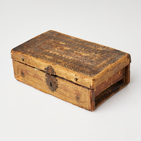 A 17th-century box, wooden frame clad with embossed leather, inside ...