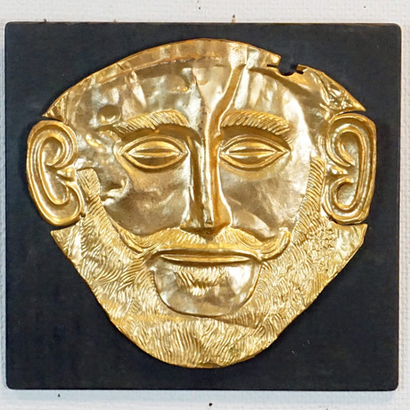 A wall relief, replica of the golden mask from Mycenae (the death mask ...