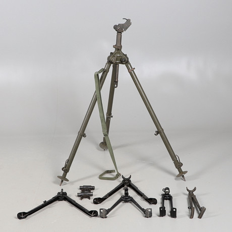 A MILITARY MACHINE GUN TRIPOD AND A COLLECTION OF SMALLER BARREL ...