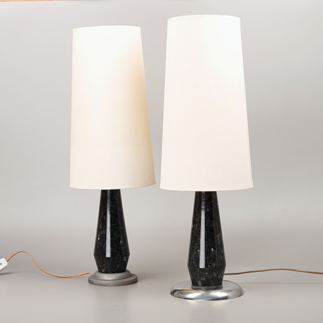 A pair of similar model stones/metal table lamps, mid 20th century ...