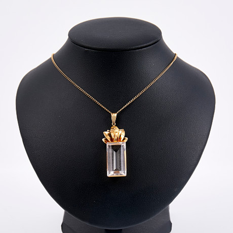COLLIER, 18 k guld, pansarkedja, hänge med baguettslipade bergskristall ...