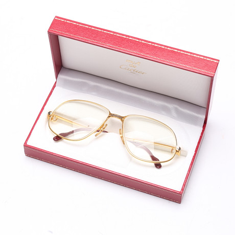 CARTIER. A pair of glasses and two boxes, Must de Cartier, Paris ...