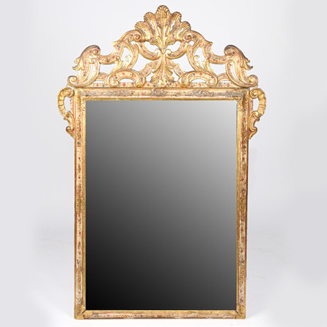 A DECORATIVE CONTINENTAL GILT GESSO AND POLYCHROME WALL MIRROR. Mirrors ...