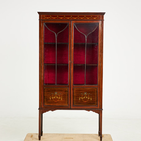 An early 20th century display cabinet, mahogany veneer decorated with ...