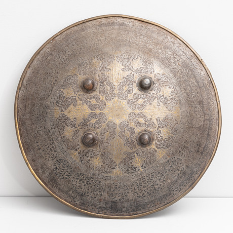 A wall shield, patinated metal, Middle Eastern, 18th/20th century ...