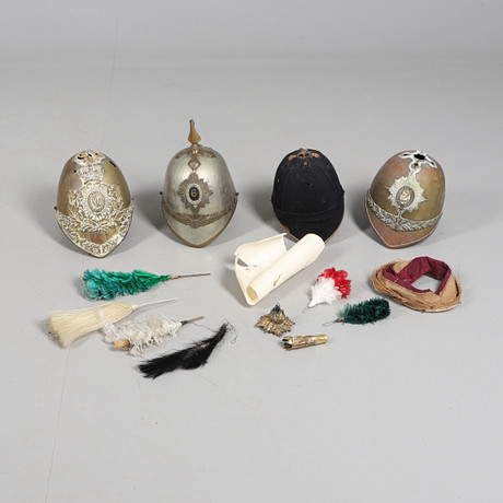 A COLLECTION OF VICTORIAN AND LATER HELMETS AND PARTS TO INCLUDE 1871 ...