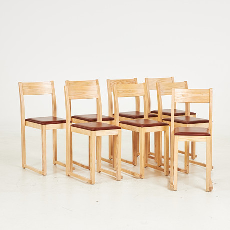A set of 8 stackable chairs, light oak, reportedly designed by the ...