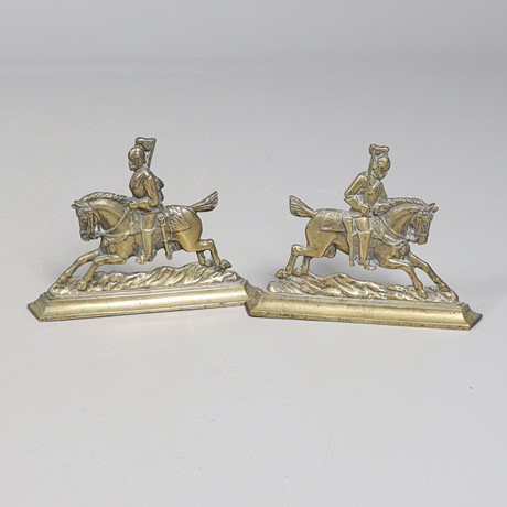 A NEAR PAIR OF VICTORIAN STYLE DOOR STOPS IN THE FORM OF LANCERS ...