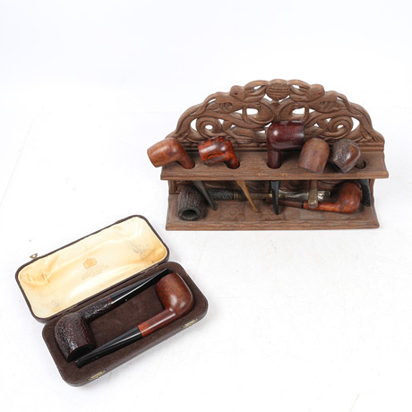 A CHINESE HARDWOOD PIPE RACK WITH CONTENTS AND A DUNHILL PIPE SET (2 ...