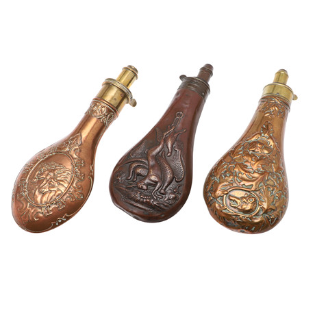 A COLLECTION OF THREE HIGHLY DECORATED COPPER POWDER FLASKS. Weapons ...