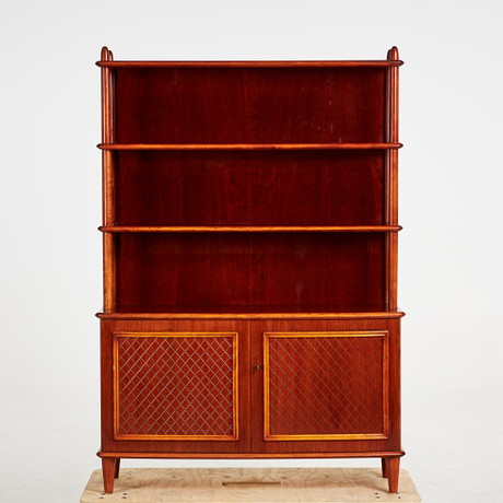 A colonial style mahogany veneer shelf with cupboard doors and back ...