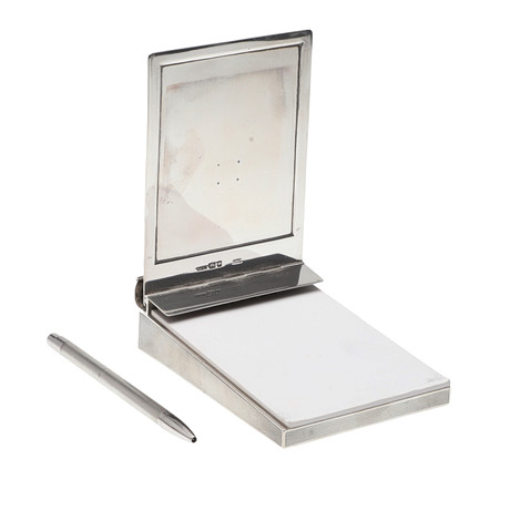 A GEORGE V SILVER MOUNTED NOTEPAD HOLDER & MATCHING BALLPOINT PEN, BY ...