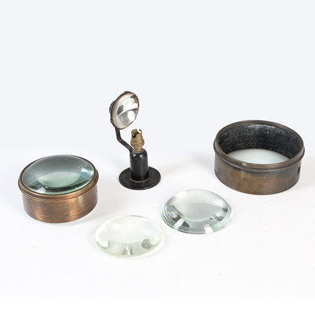 FOUR SCIENTIFIC MAGIC LANTERN LENSES AND A PARABOLIC MIRROR LAMP (5 ...