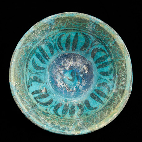 A bowl, Persian, Kashan, circa 12th-13th century AD, decor in black ...
