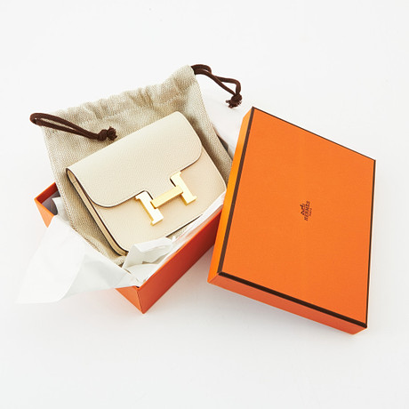 HERMÈS, “Constance Slim”, calfskin wallet, H-shaped buckle in shiny ...
