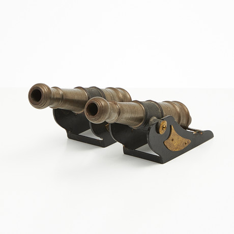 A pair of salutting cannons, 20th century, iron fire pipes, lavettes of ...