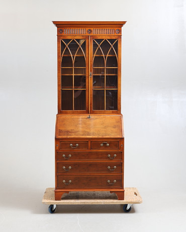 A 20th century English Reprodux writing desk with display case ...