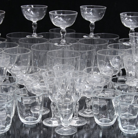 ELIS BERGH. A 54-piece glass tableware set with cut stars, Kosta, 20th ...