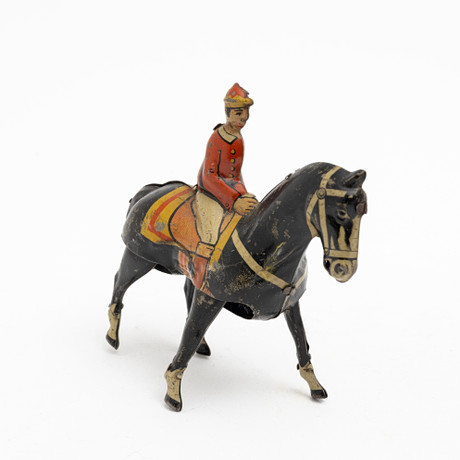 A MECHANICAL TOY, sheet metal, Horse with Jockey, Keim & Co, 1930's ...