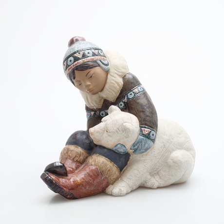 A stoneware Eskimo figure with a polar bear, Lladro. Ceramics ...