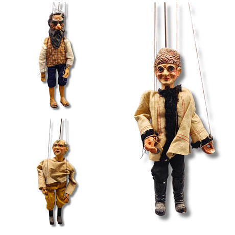 A COLLECTION OF HAND-CARVED PUPPETS FROM WOOD AND PLASTER IN THE MID ...