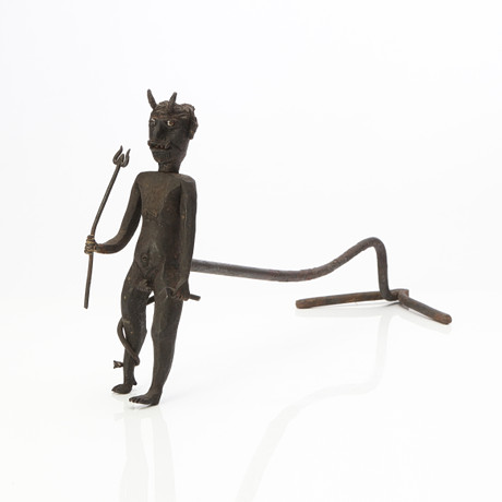 FIRE DOG. Forge. In the form of the devil. 20th century. Silver ...