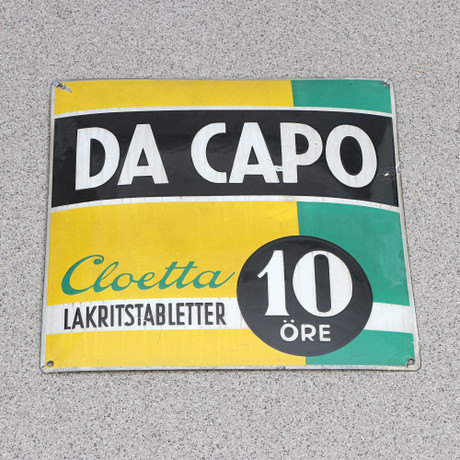 DA CAPO, CLOETTA, ENAMEL SIGN. Enameled metal. Mid 20th century. Silver ...